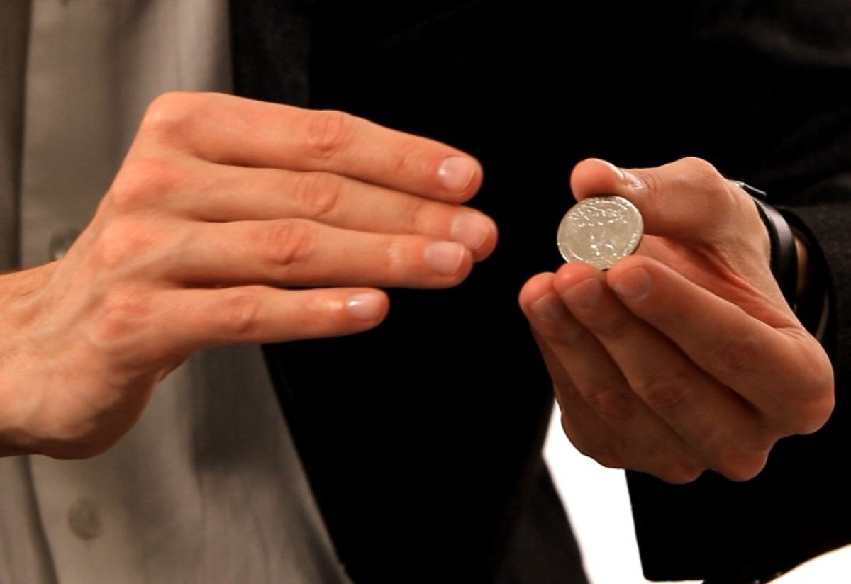 How To Change A Penny To A Quarter With Magic Howcast how-to-change-a-penny-to-a-quarter-with-magic-howcast